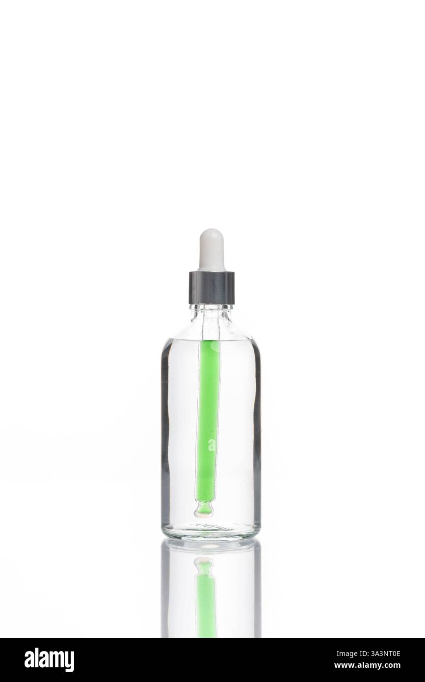 Transparent dropper bottle with white bottom and green dropper Stock ...