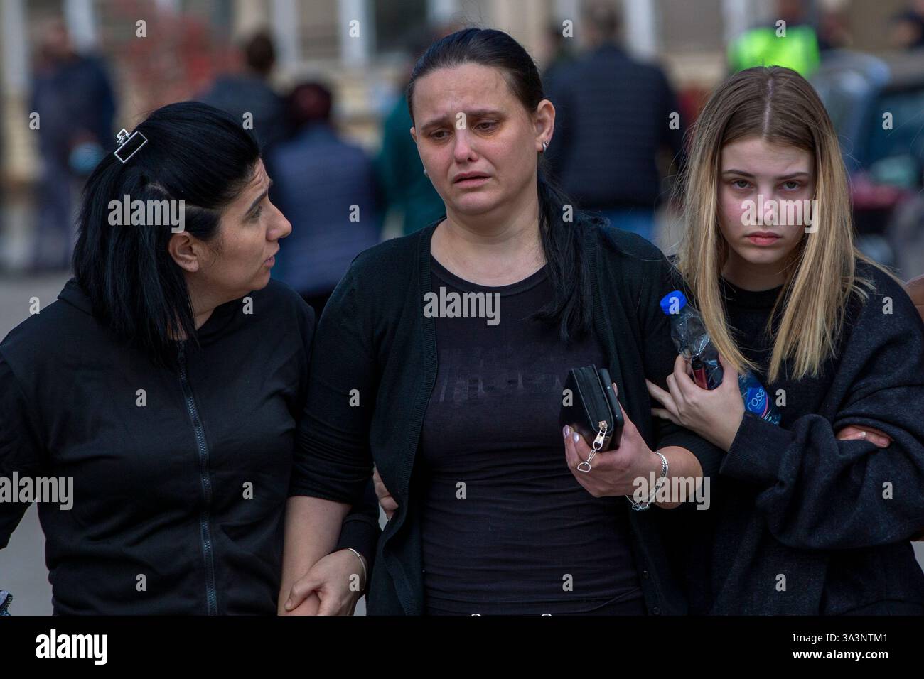 Relatives of victims leave a hospital in the town of Kocani, North ...