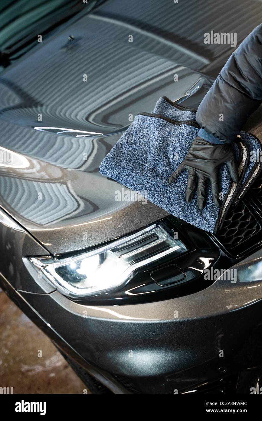 Car detailing - polishing car using microfiber cloth. Professional car ...