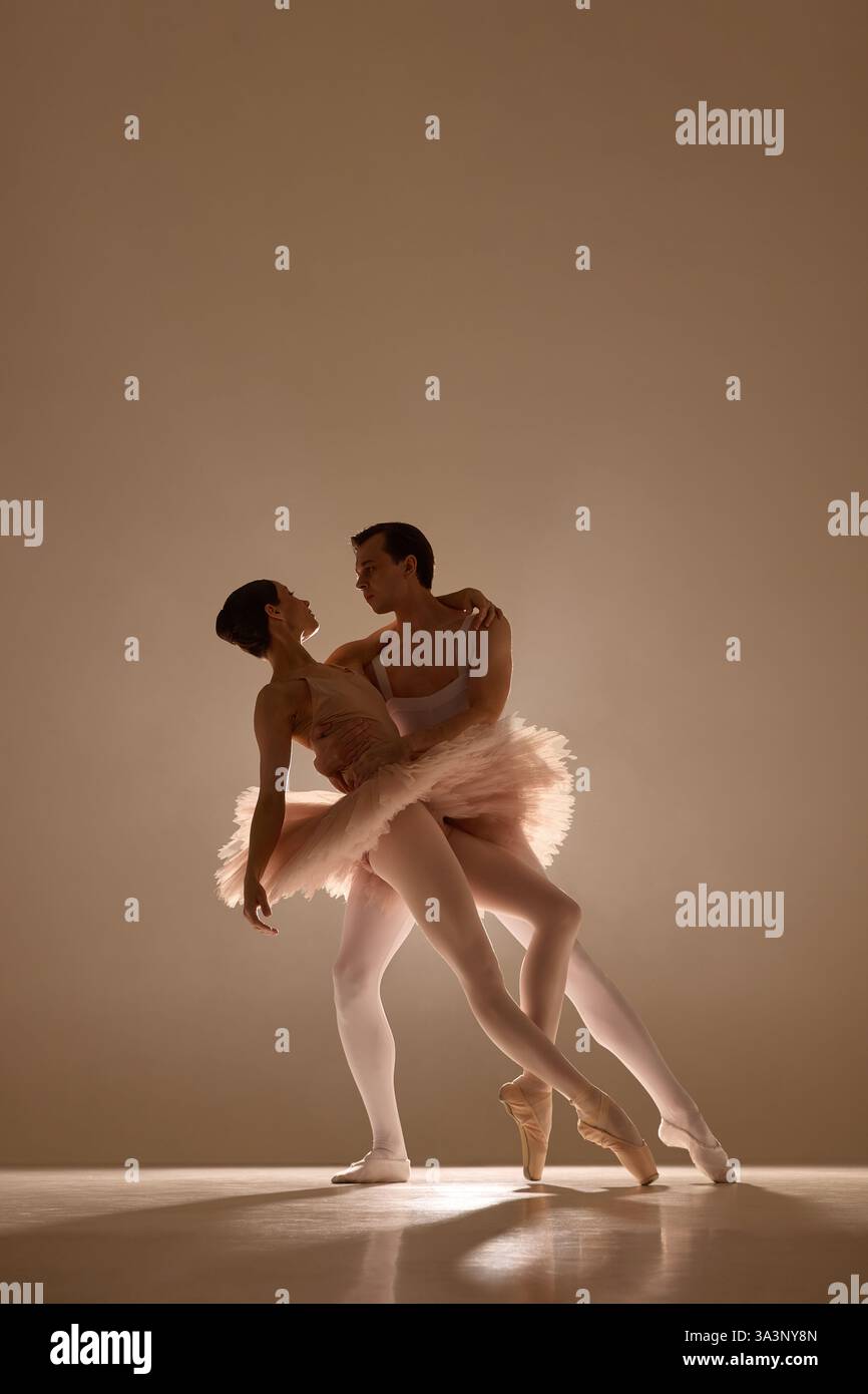 Ballet duet in poised embrace, bodies aligned in perfect balance ...