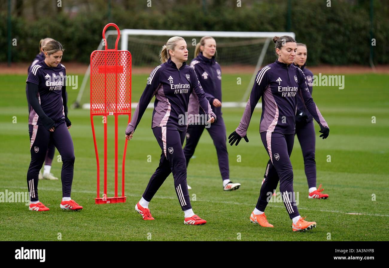 Arsenal players warm up during a training session at the Sobha Realty ...