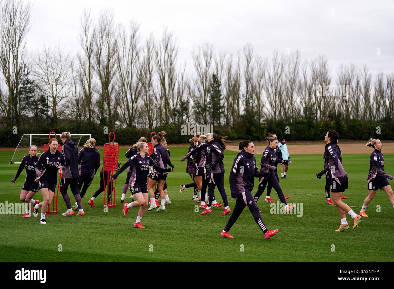 Arsenal players warm up during a training session at the Sobha Realty ...