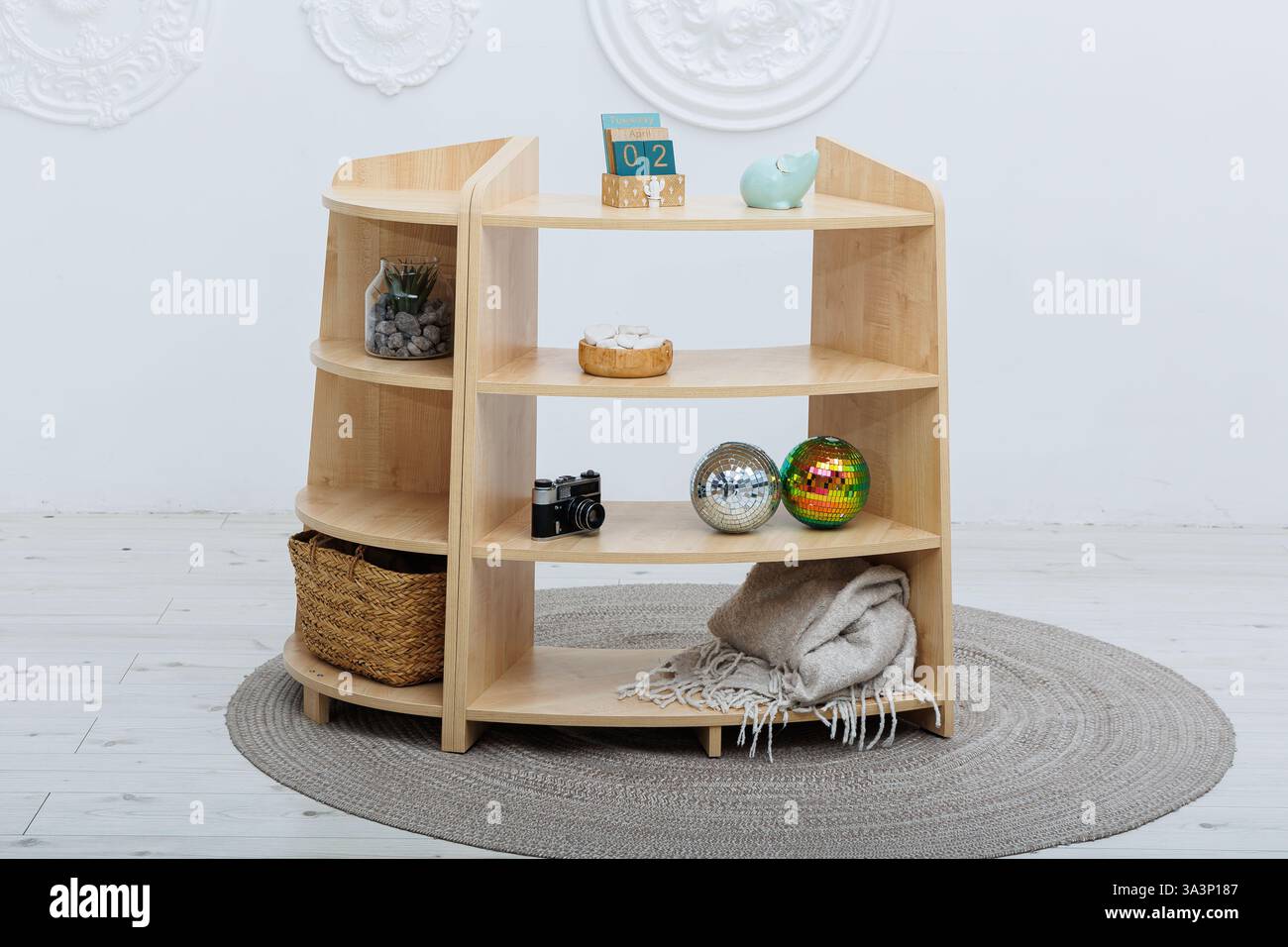 A beautifully crafted wooden shelf displays a charming piggy bank ...