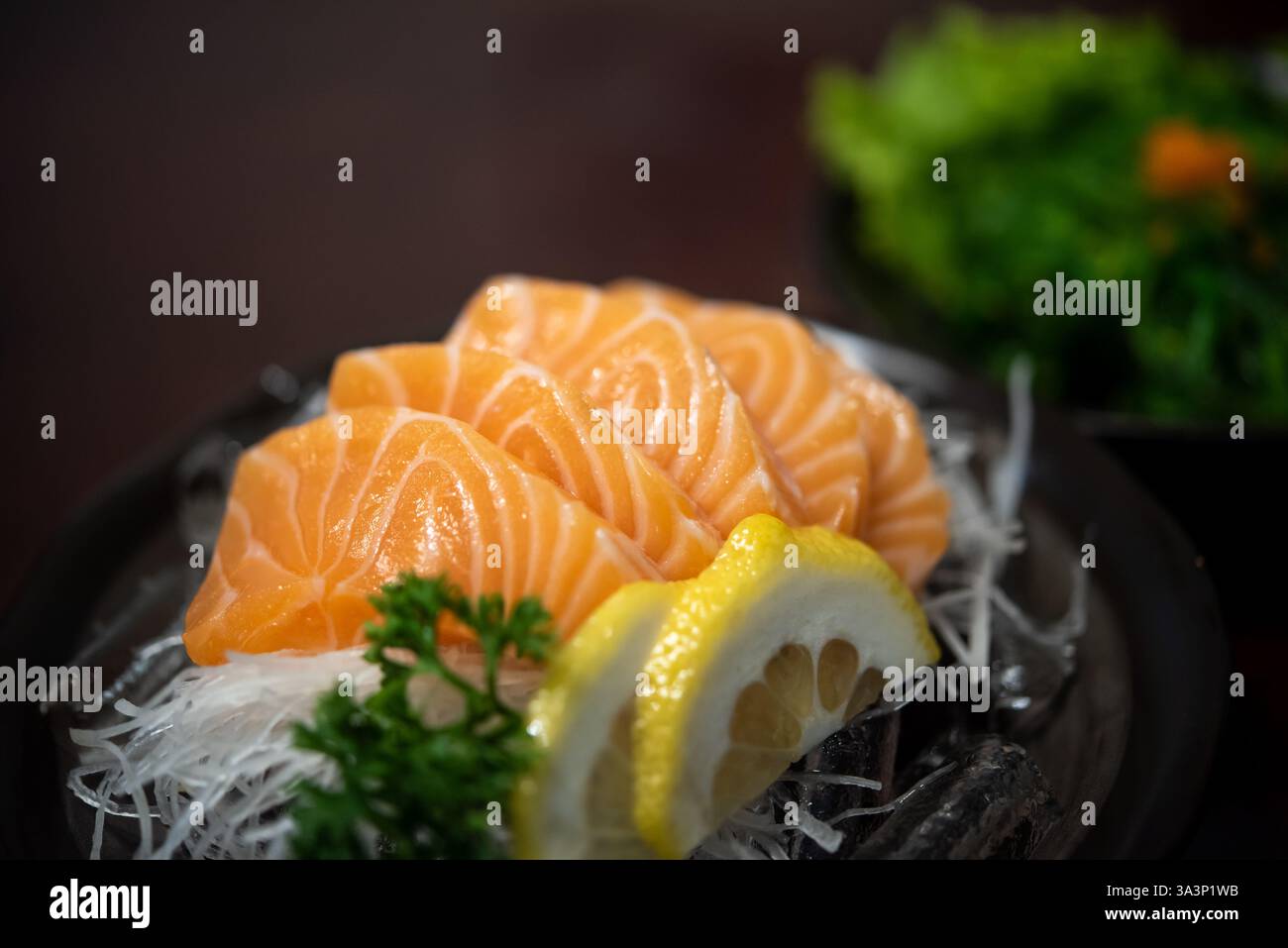 Japanese food delicacy consisting sashimi salmon of very fresh raw ...