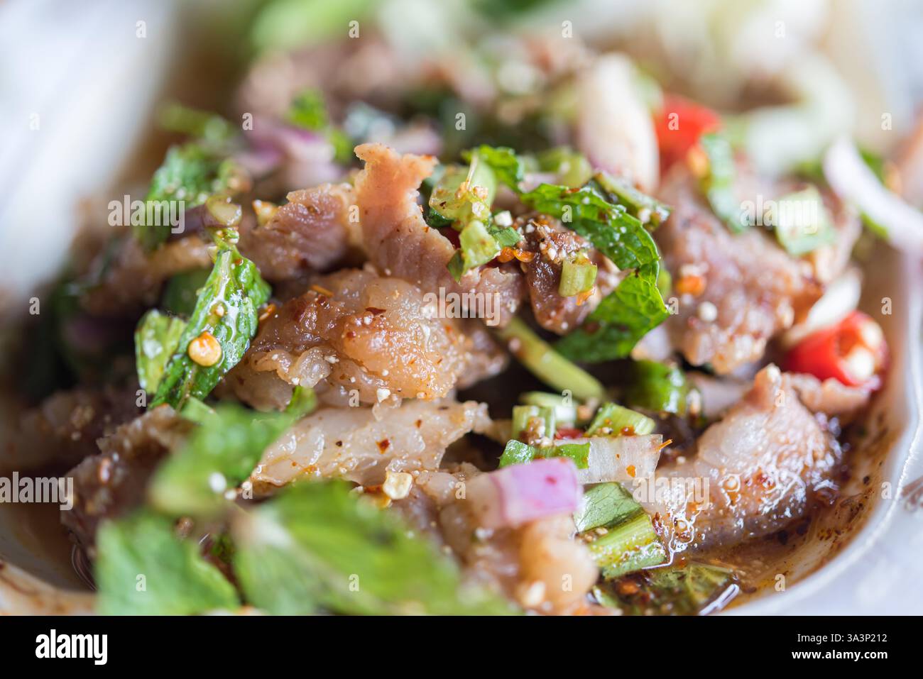 Spicy sliced grilled beef salad (Nam Tok) is a Thai food for health ...