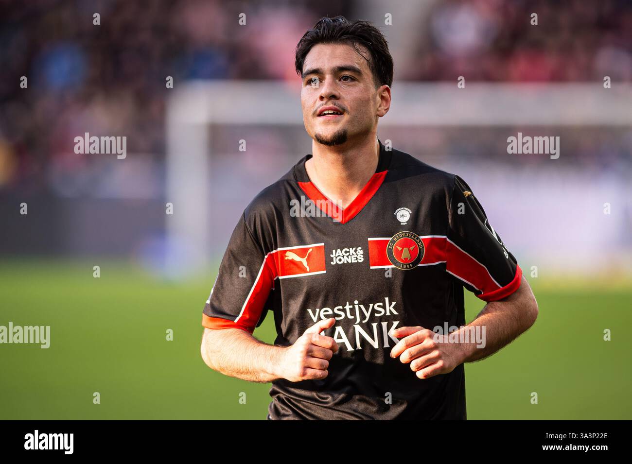 Herning, Denmark. 16th Mar, 2025. Aral Simsir (58) of FC Midtjylland ...