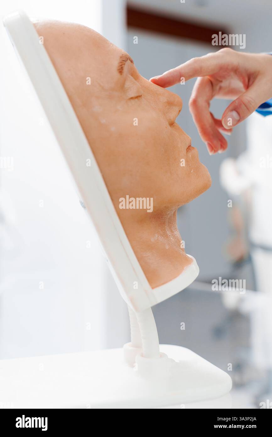 Demonstrating rhinoplasty procedure on a mannequin in the medical ...
