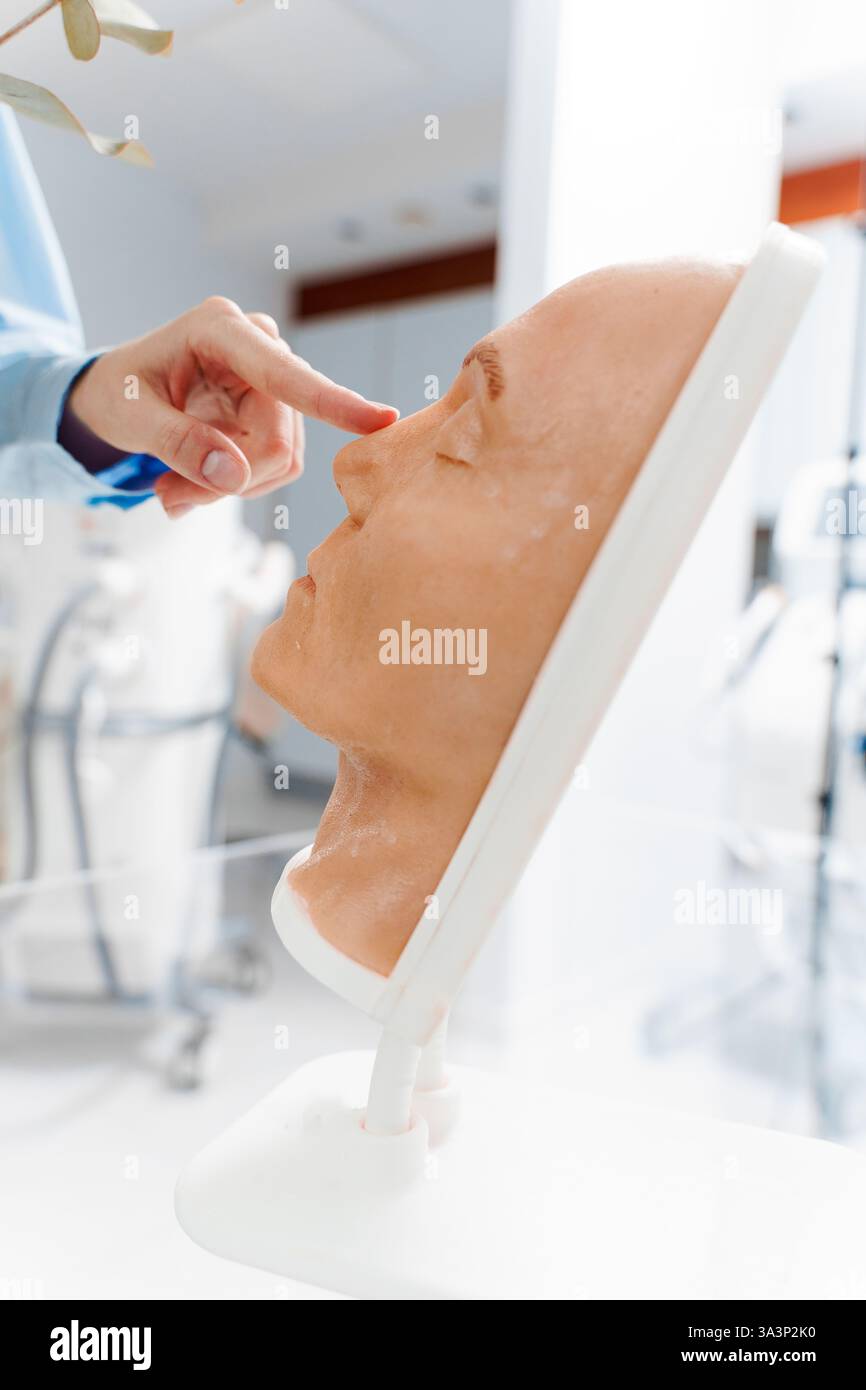 Demonstrating rhinoplasty procedure on a mannequin in the medical ...