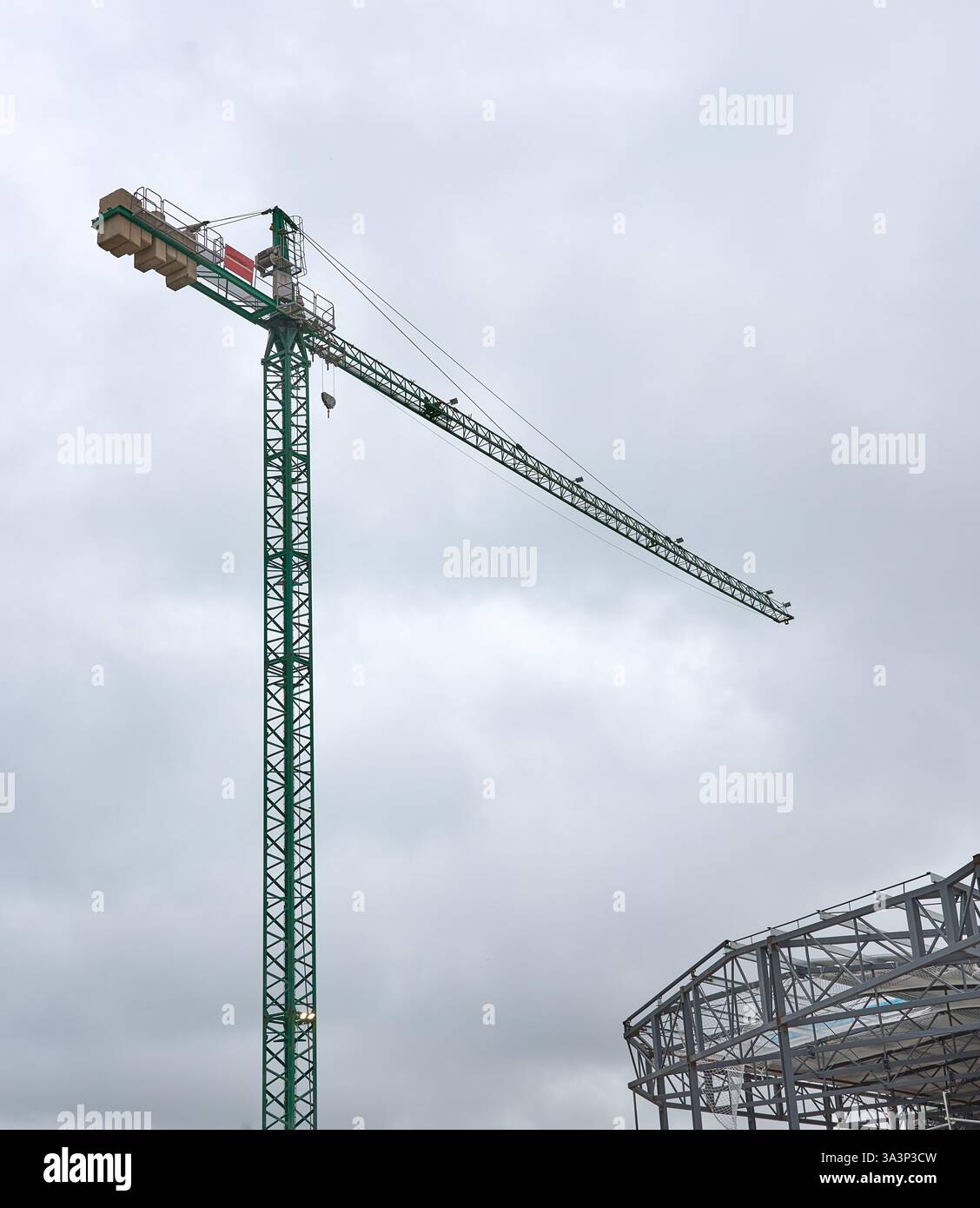 Construction site crane over building carcass Stock Photo - Alamy