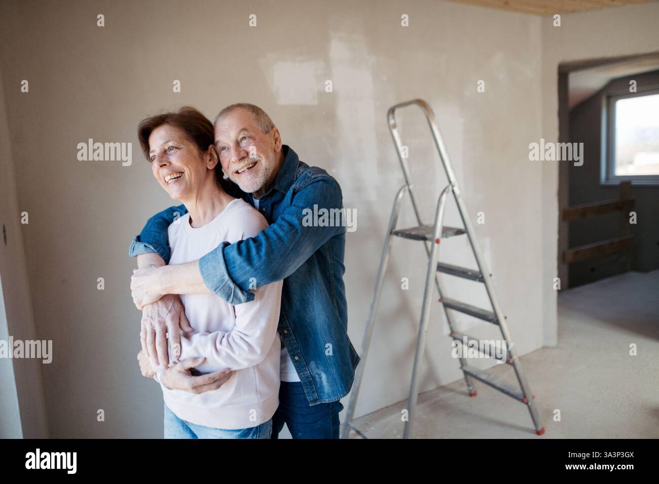 Senior couple renovating their home, a shared retirement activity Stock ...