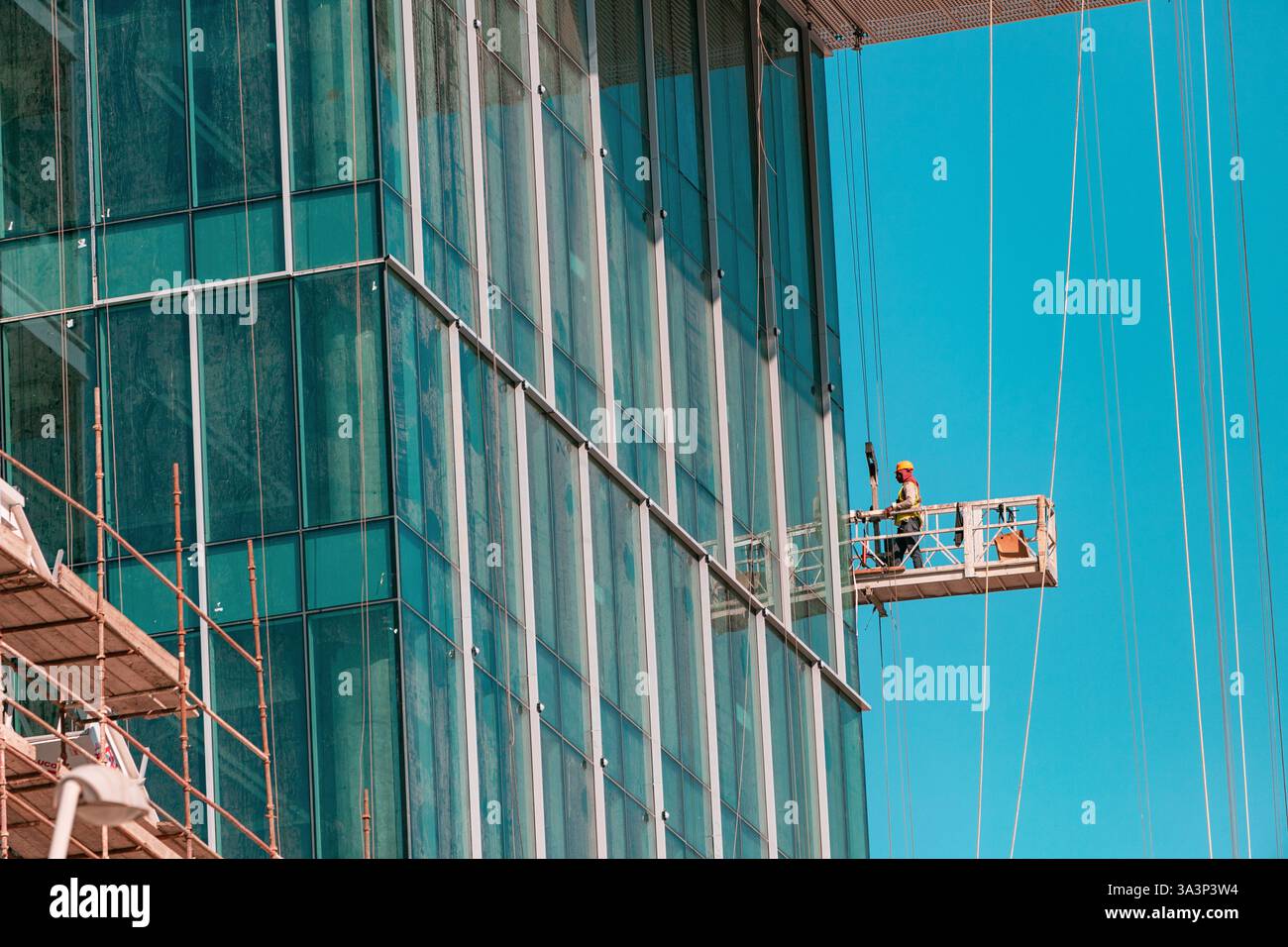 21 January 2025, Abu Dhabi, UAE: Construction worker standing on ...