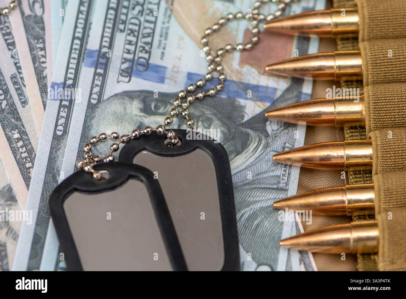 Symbols of war: cartridges and tokens, money. Close-up of cartridges ...