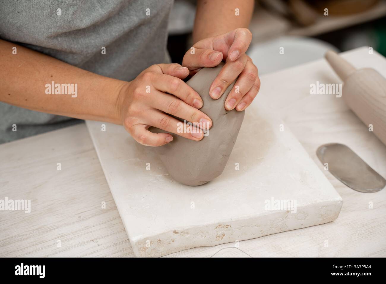 Removing air bubbles from clay before modeling to avoid the ruination ...