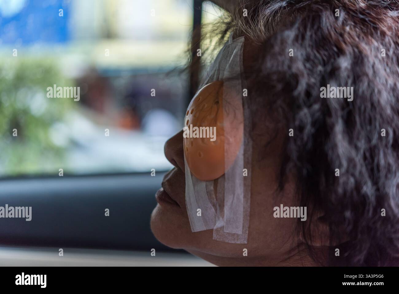 Patient asian elder women 60s with black hair and wrinkled on face show ...