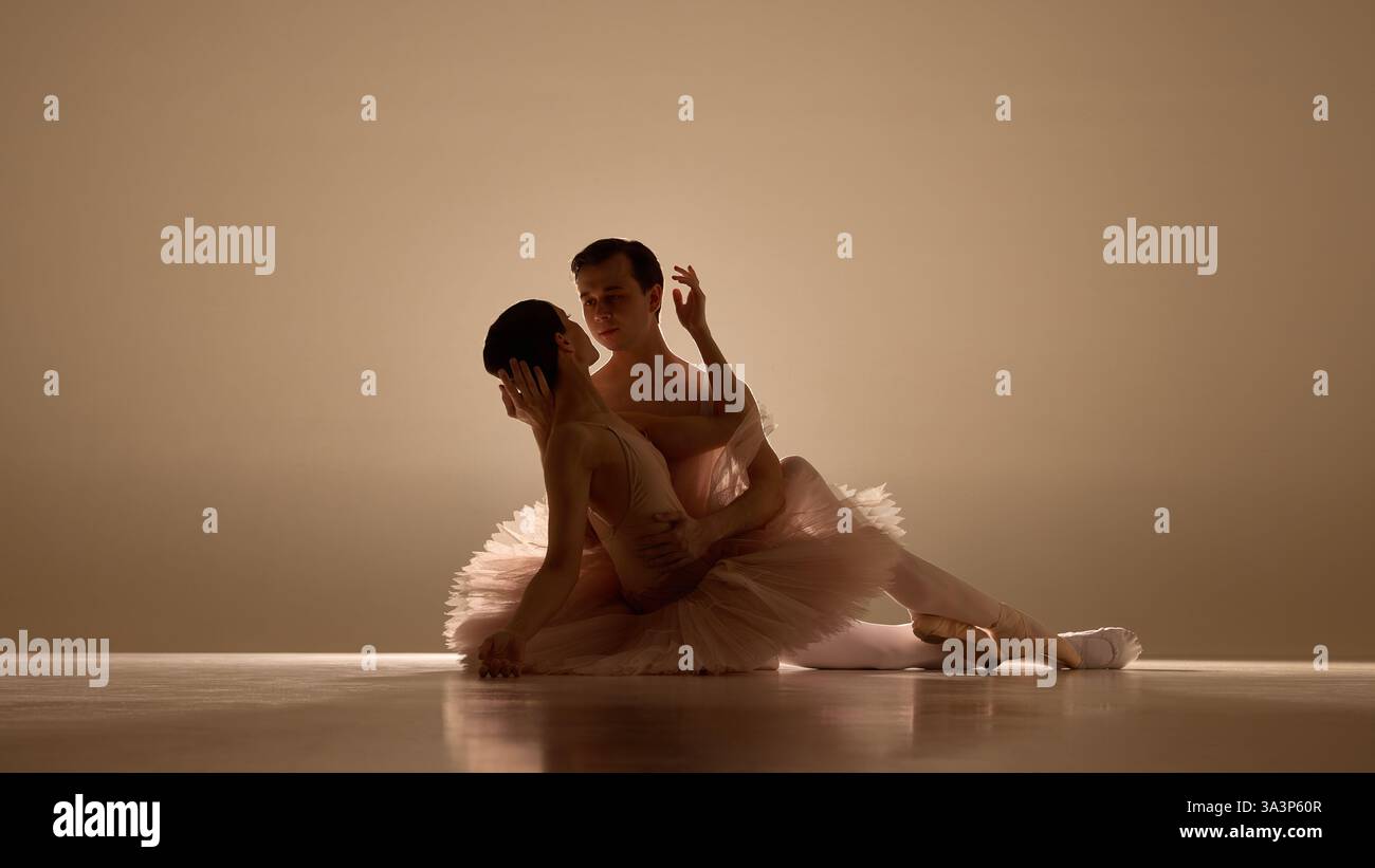 Ballet partners create dramatic pose, woman arching back into man's ...