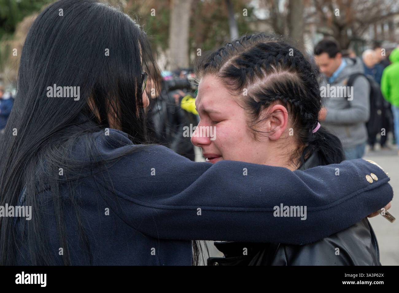 A girl cries as she wait in line to write condolence messages for the ...