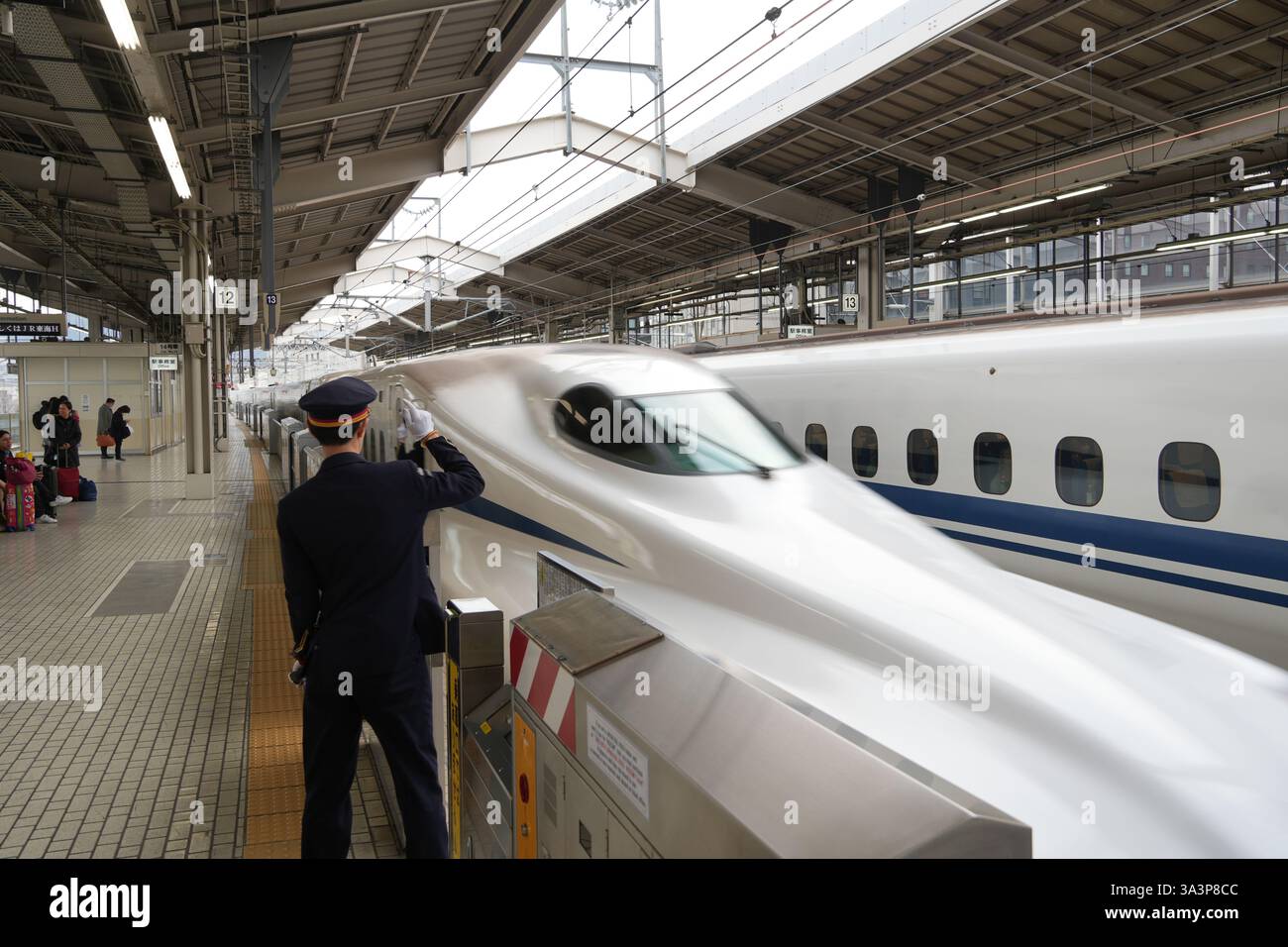 Bullet train and conductor in uniform, Kyoto station, Japan, Asia Stock Photo - Alamy