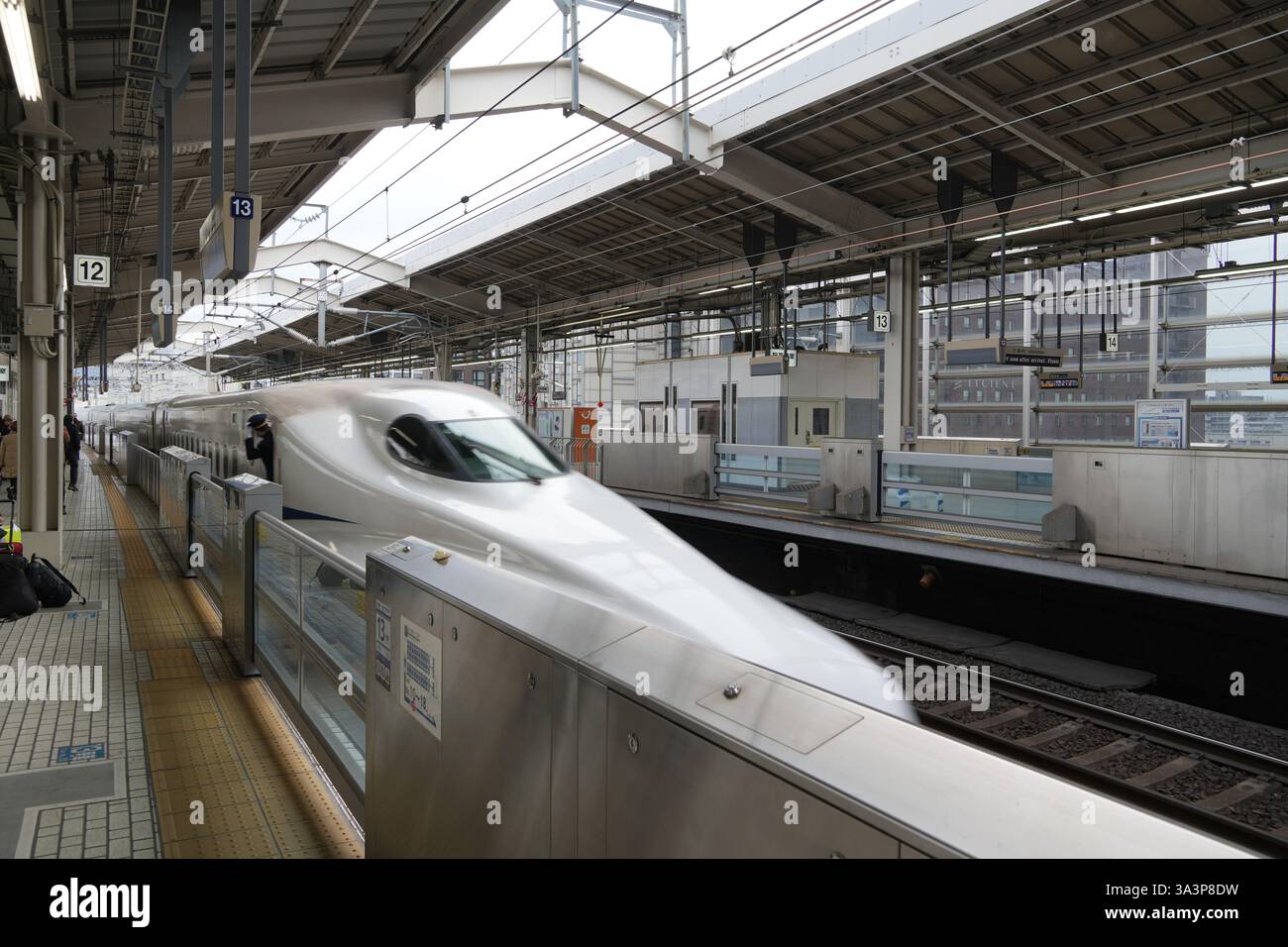 Bullet train and conductor in uniform, Kyoto station, Japan, Asia Stock ...