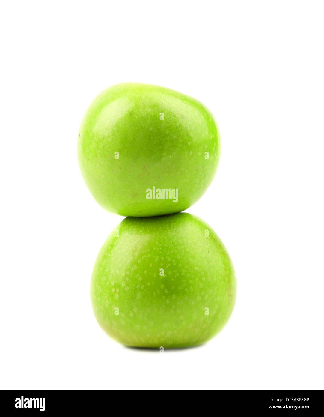 Two green apples. Vertical. Close up. White background Stock Photo - Alamy