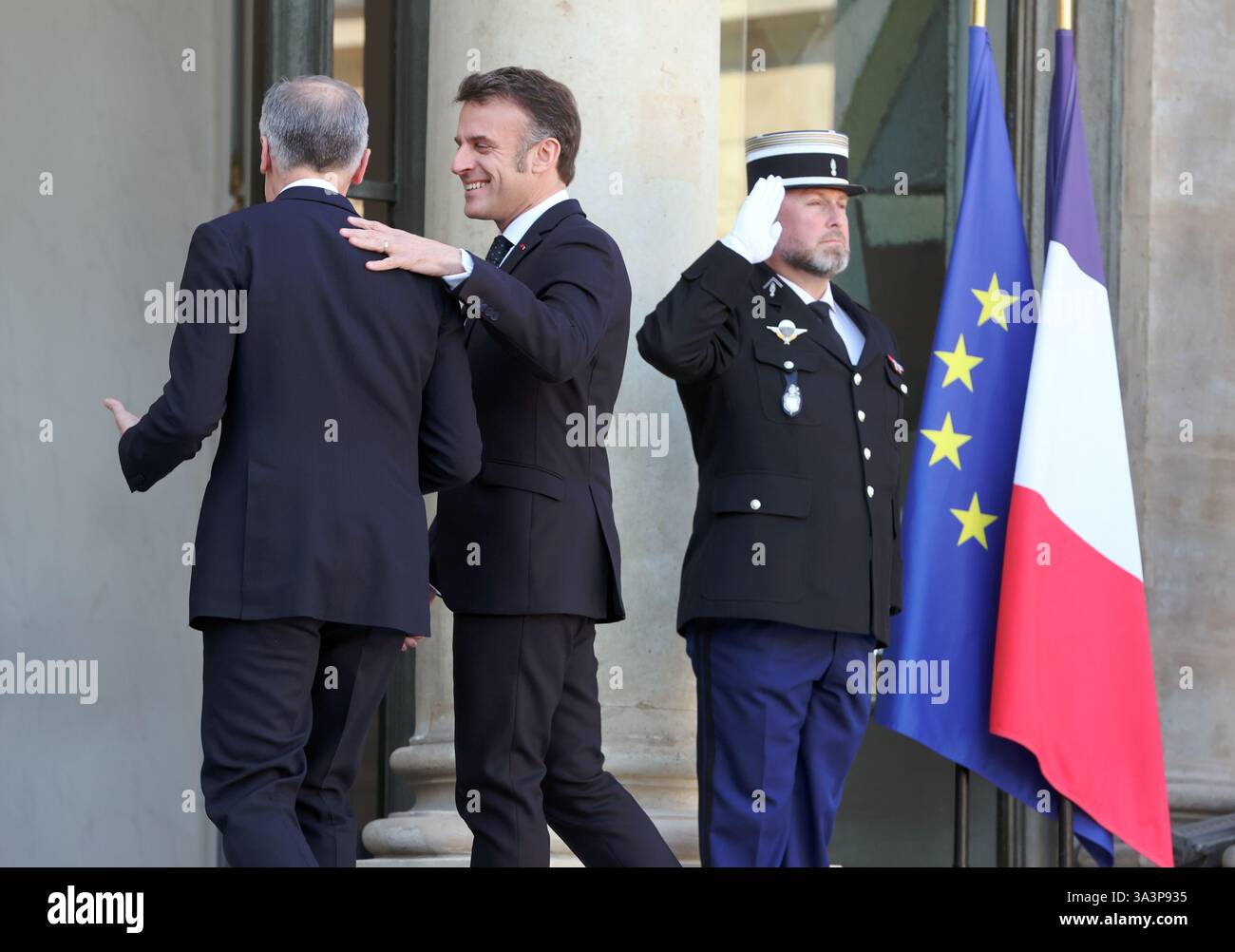 French President Emmanuel Macron (L) greets new Canadian Prime Minister ...