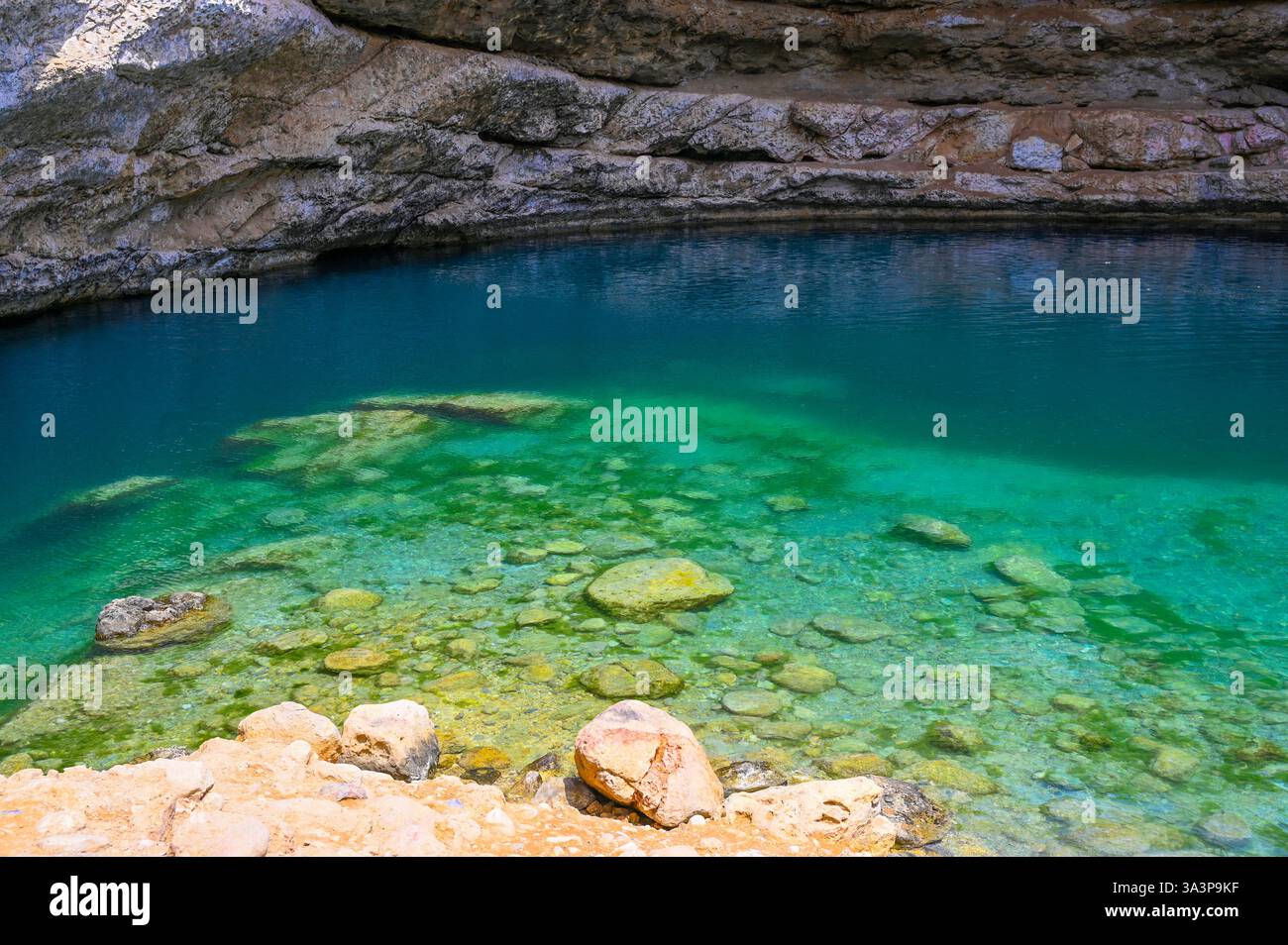 Deep cave with lake at Sinkhole Park in Oman Stock Photo - Alamy