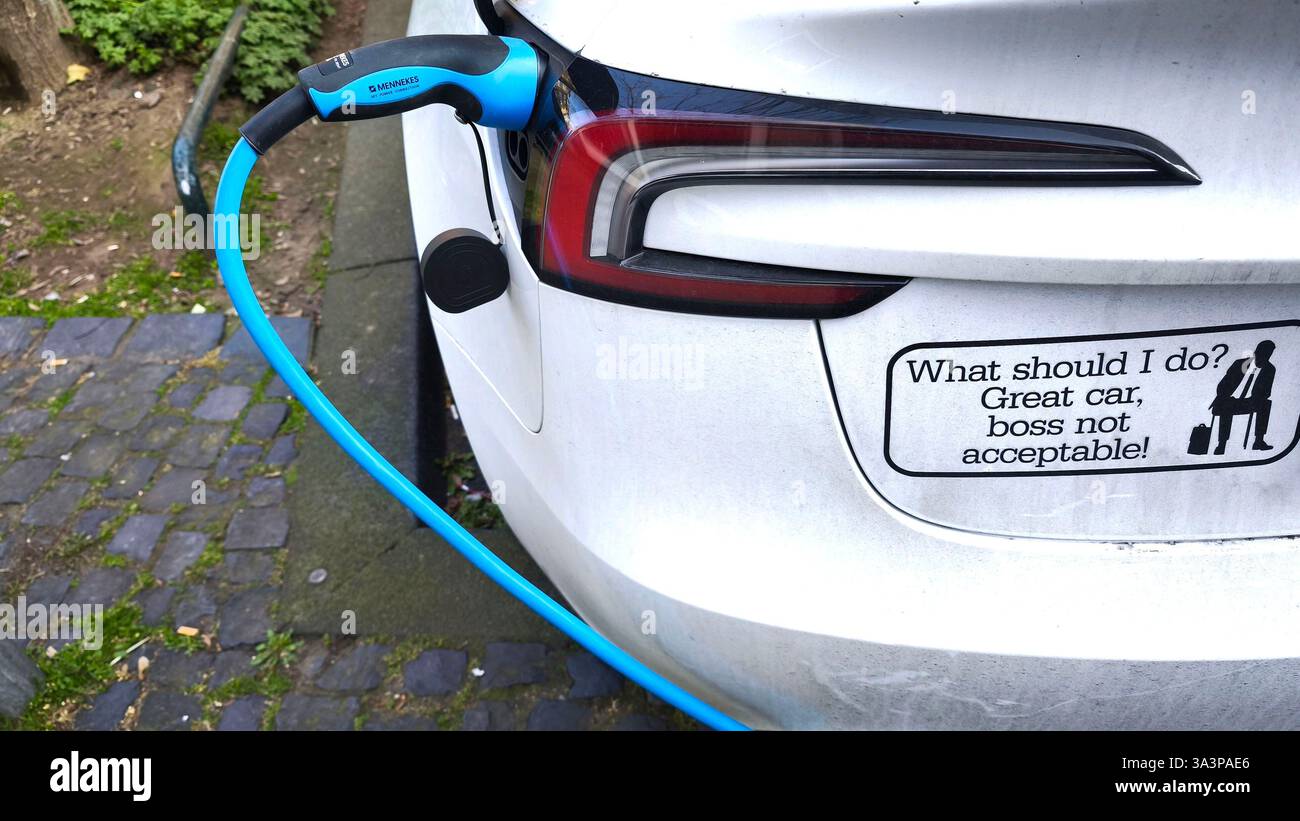 15.1032025, Düsseldorf, Germany, A Tesla electric car is being charged ...