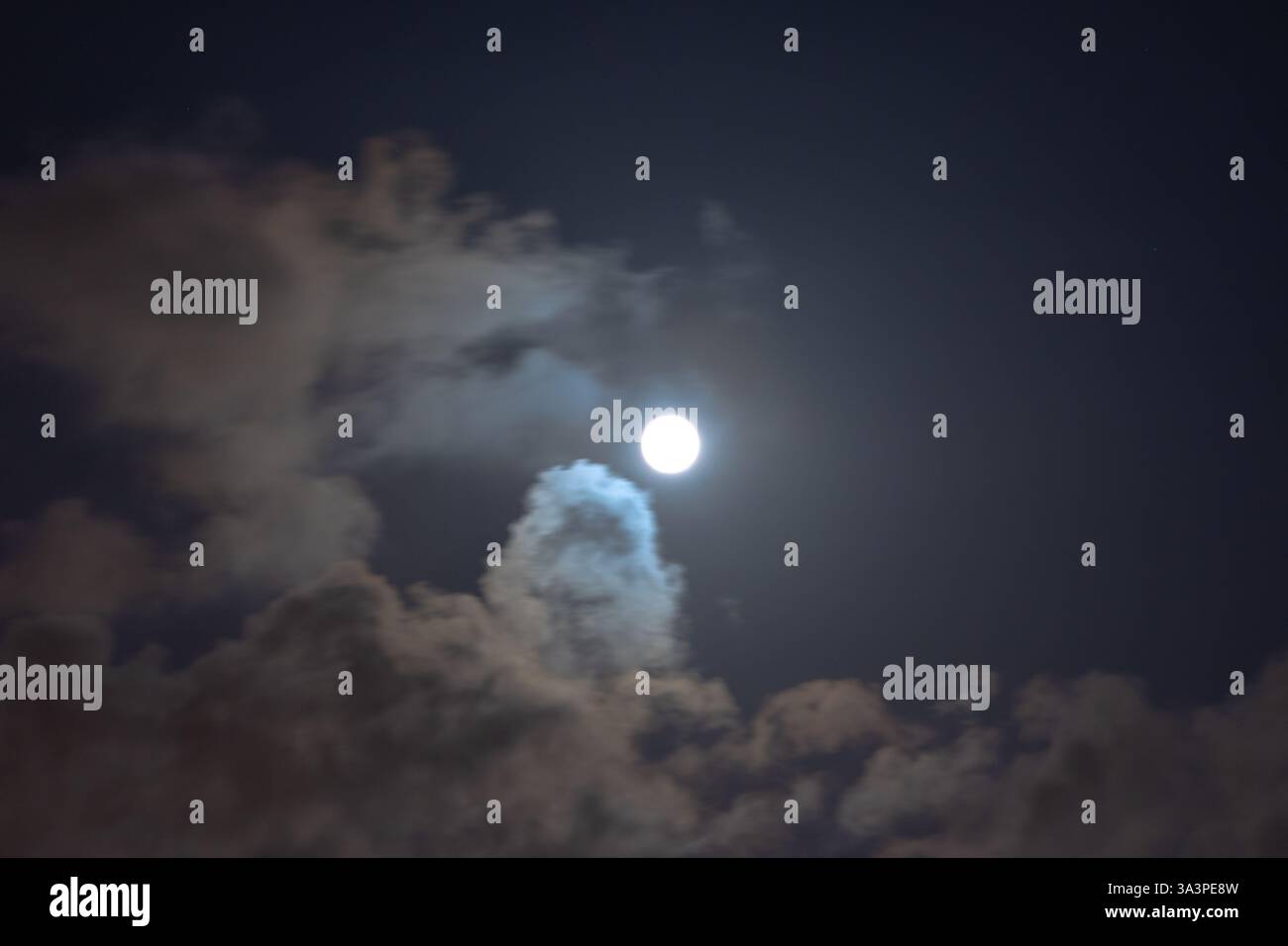 Partly cloudy sky with full moon at night. Glowing full moon Stock ...