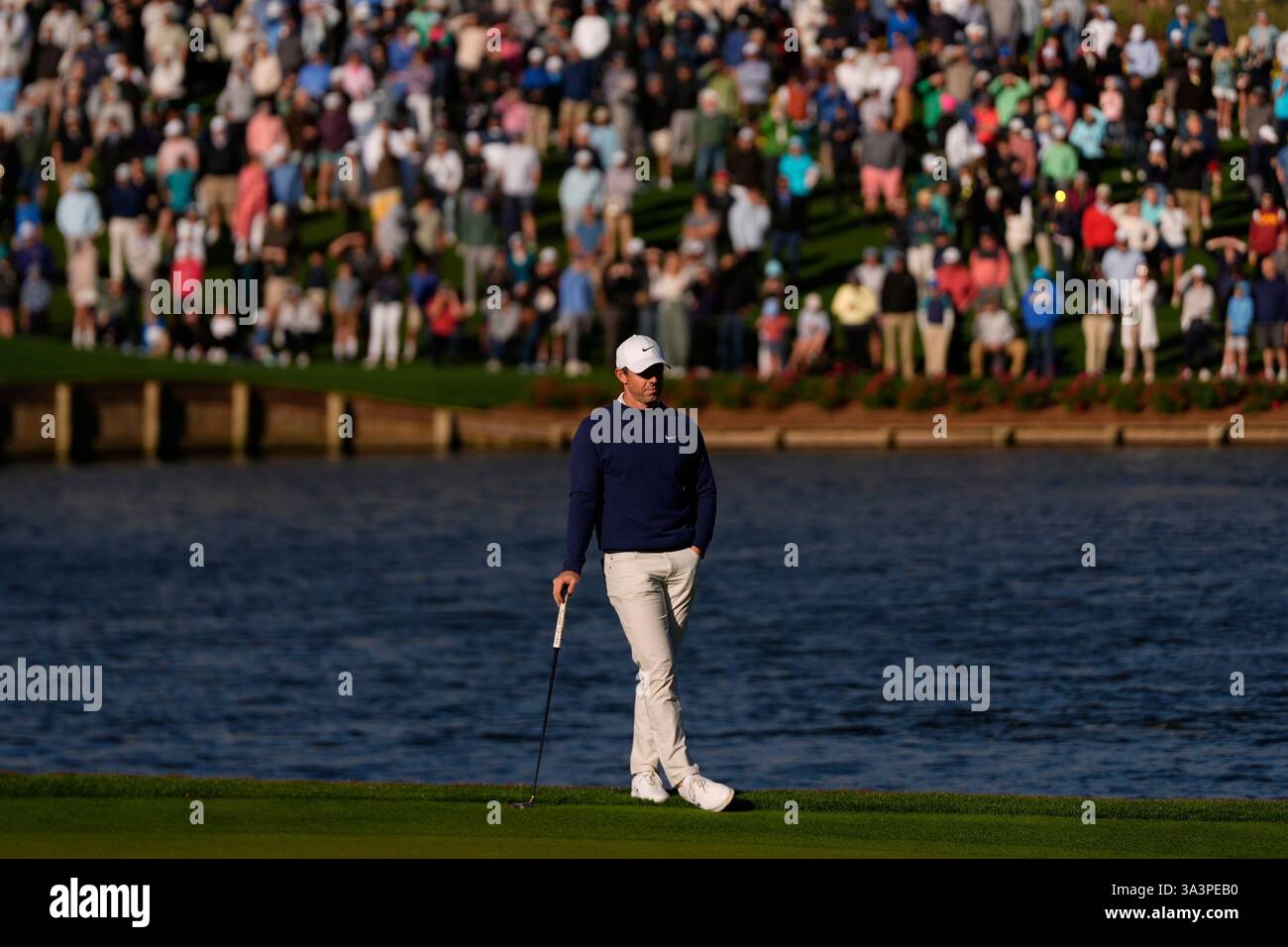 Rory McIlroy, of Northern Ireland, stands on the 16th green during a ...