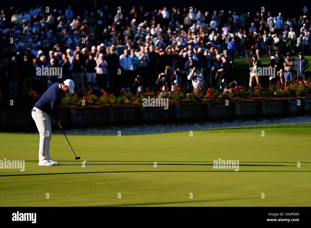 Rory McIlroy, of Northern Ireland, putts on the 16th green during a ...