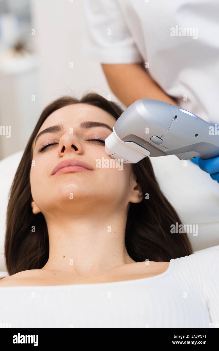 Ultraformer nonsurgical facelift process. Caucasian girl is having ...