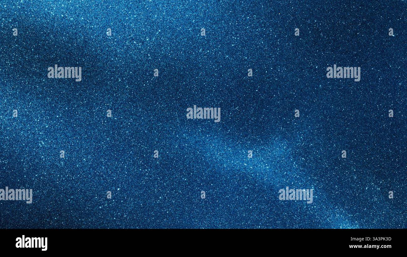 Shimmering blue glitter texture reflecting light in an artistic display ...