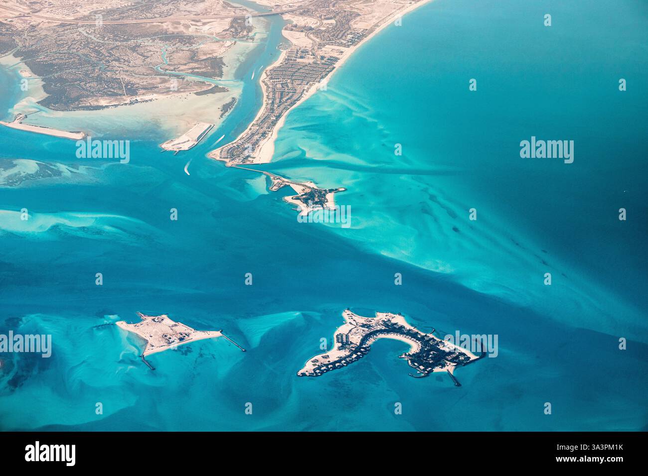 Aerial view of artificial islands under construction near the coast ...