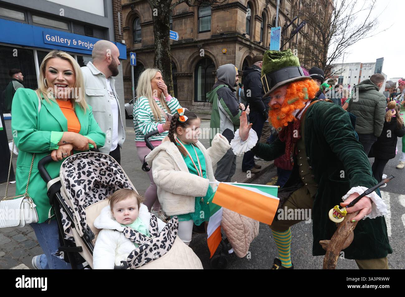 People attending the St Patrick's Day Parade in Belfast. Picture date ...