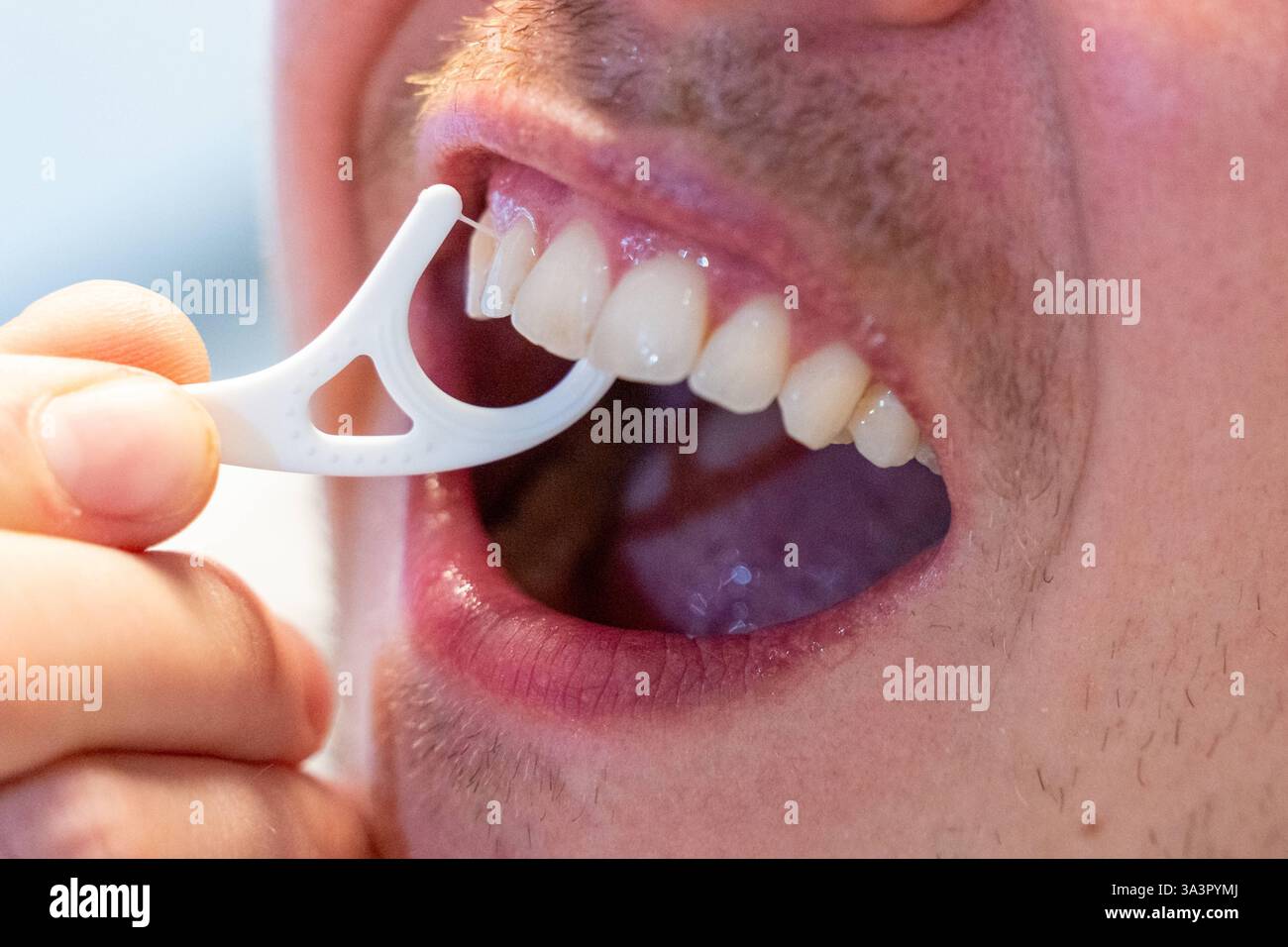 Bavaria, Germany - March 16, 2025: A hand guides a dental stick into ...