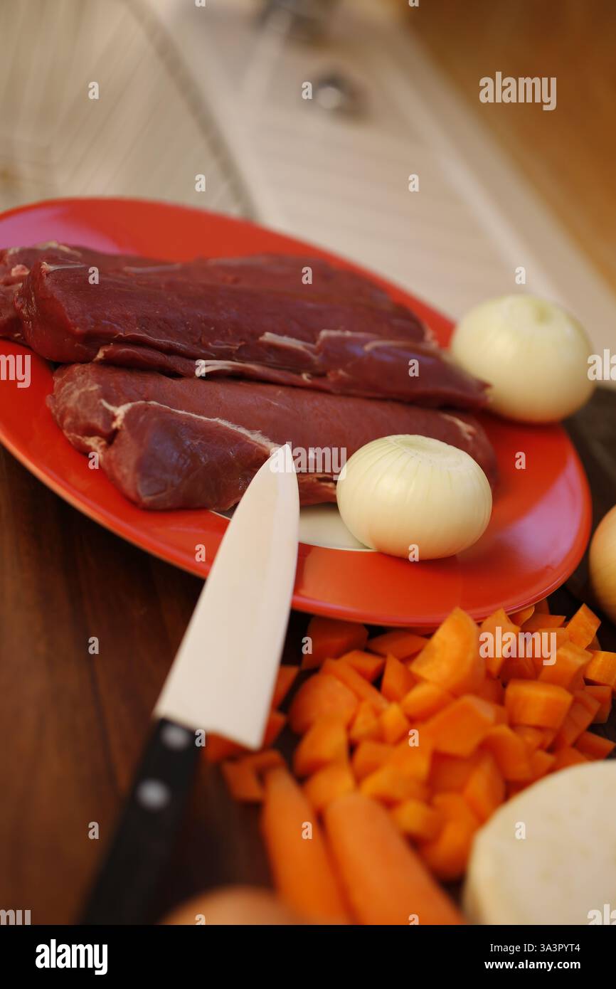Swabian cuisine, preparation of roast venison, game dish, raw meat on ...