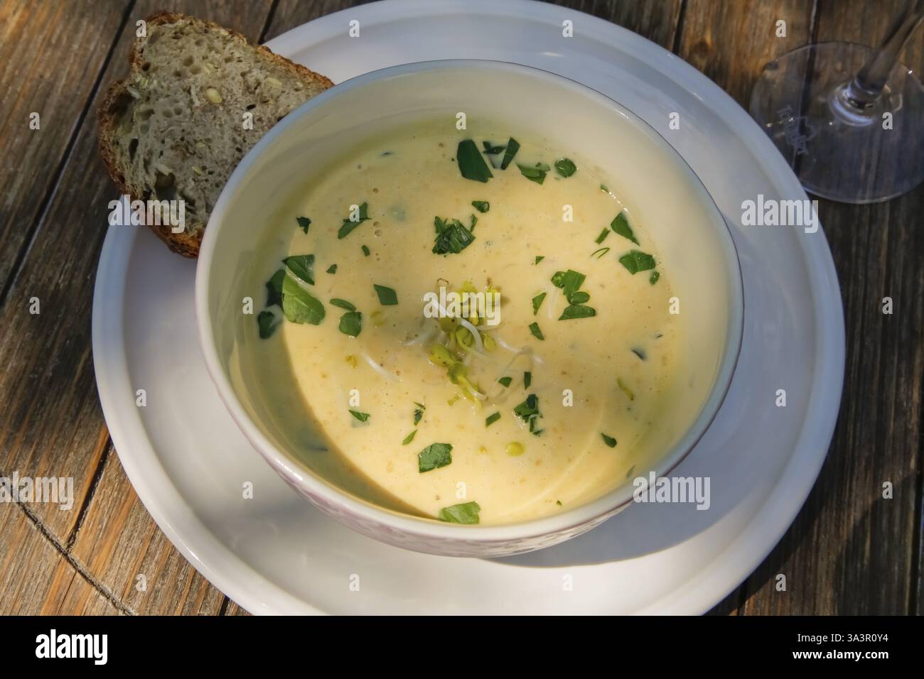 Swabian cuisine, herb soup with sprouts, slice of bread, sprouts ...