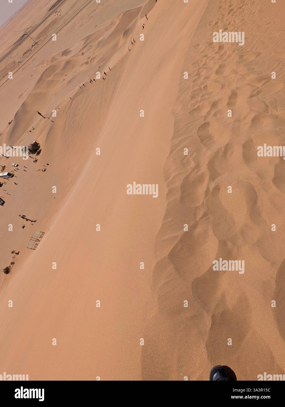 Beautiful desert sand dune showing the height and footprints of the ...