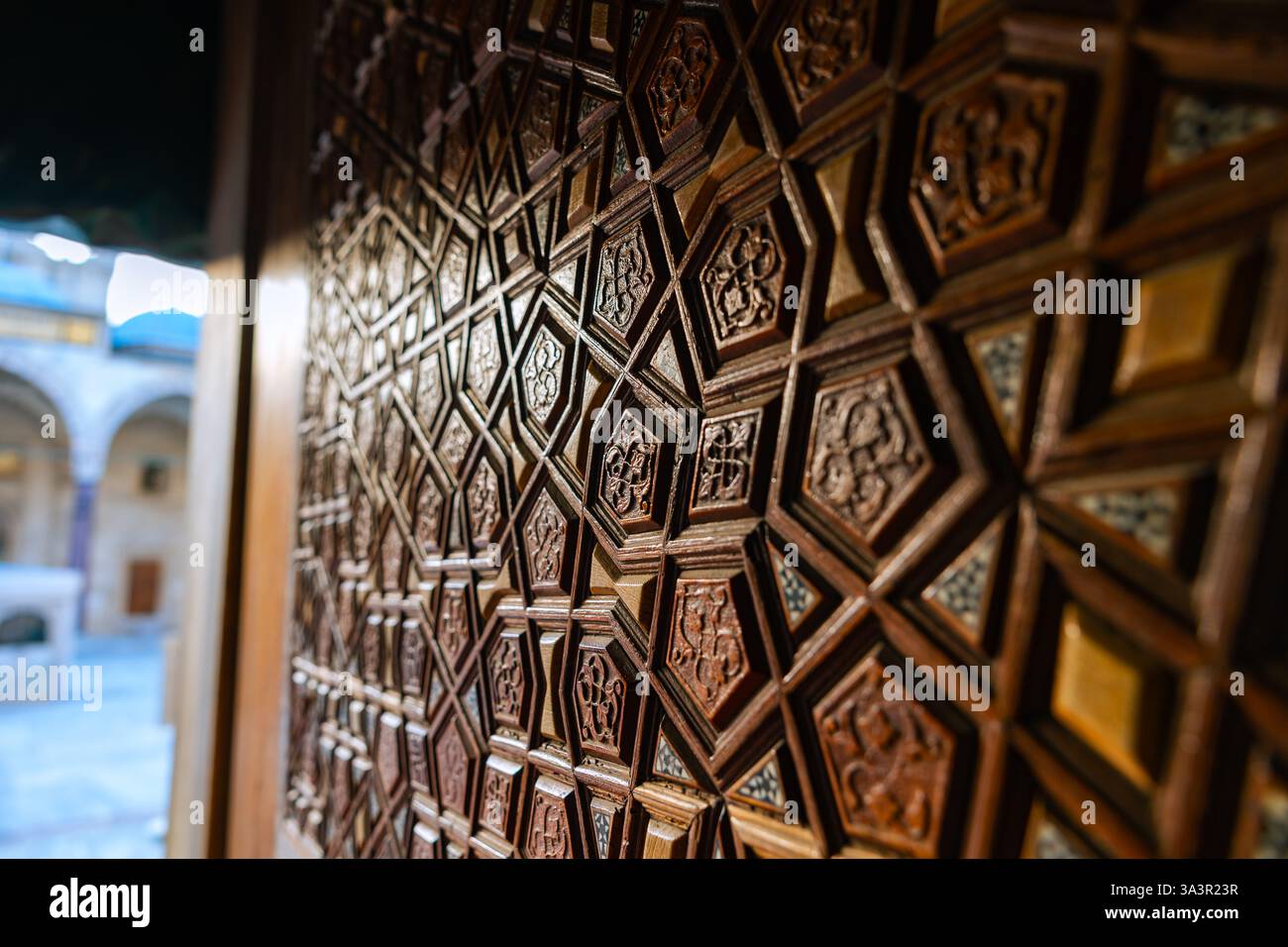Islamic geometrical pattern on the wooden door of a mosque in focus ...