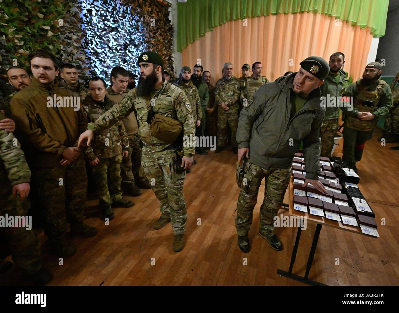 The commander of the Akhmat unit General Apti Alaudinov (right) during ...