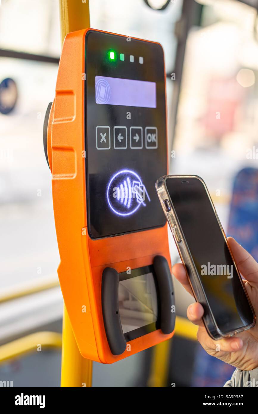 Paying for public transport by card. Public transport. Contactless fare ...