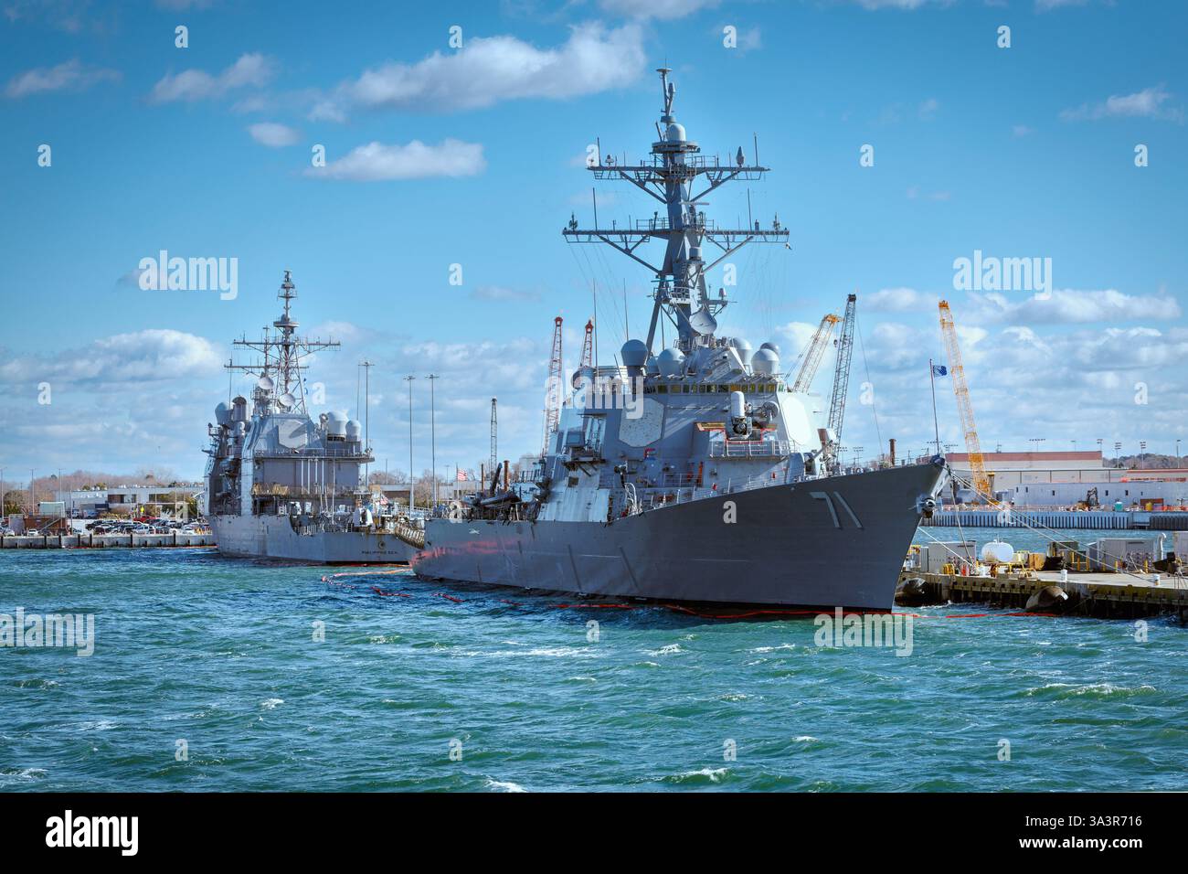 The USS Ross (DDG-71) and behind is the USS Philippine Sea (CG-58) at ...