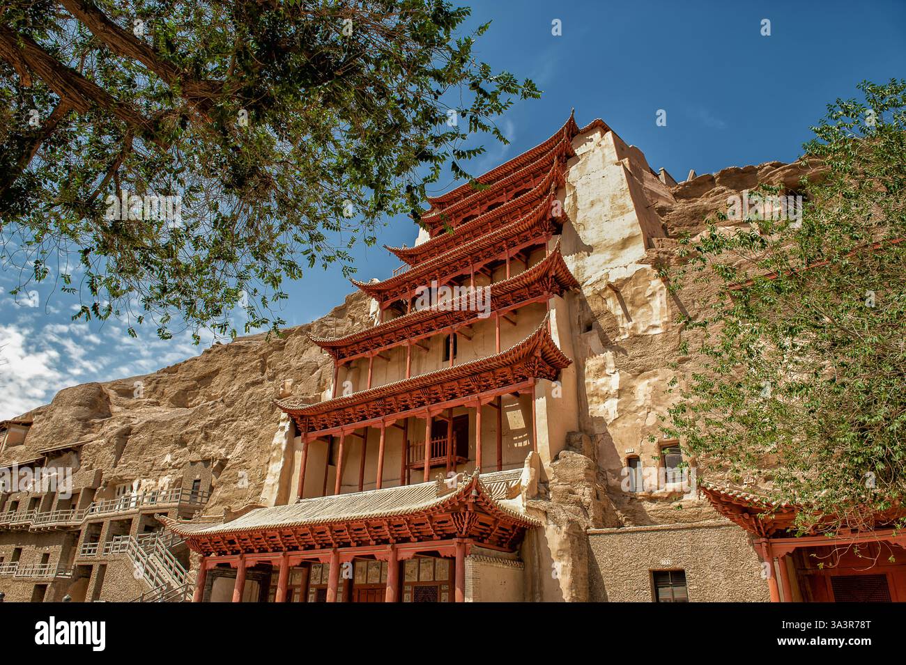 The famous Mogao caves at the Silk road in Dunhuang. Hundreds of caves ...