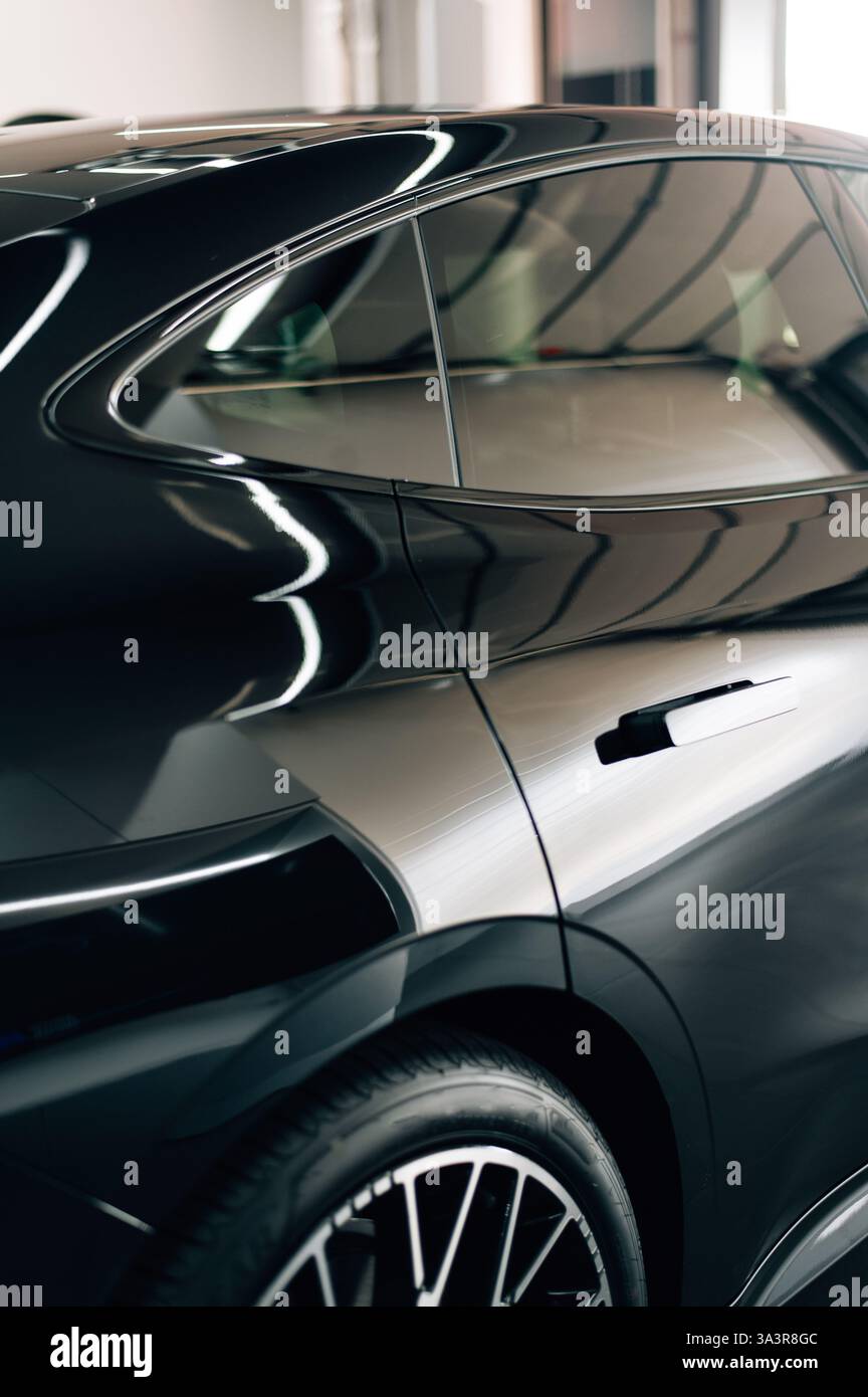 This image features a detailed closeup view of a sleek black car Stock ...