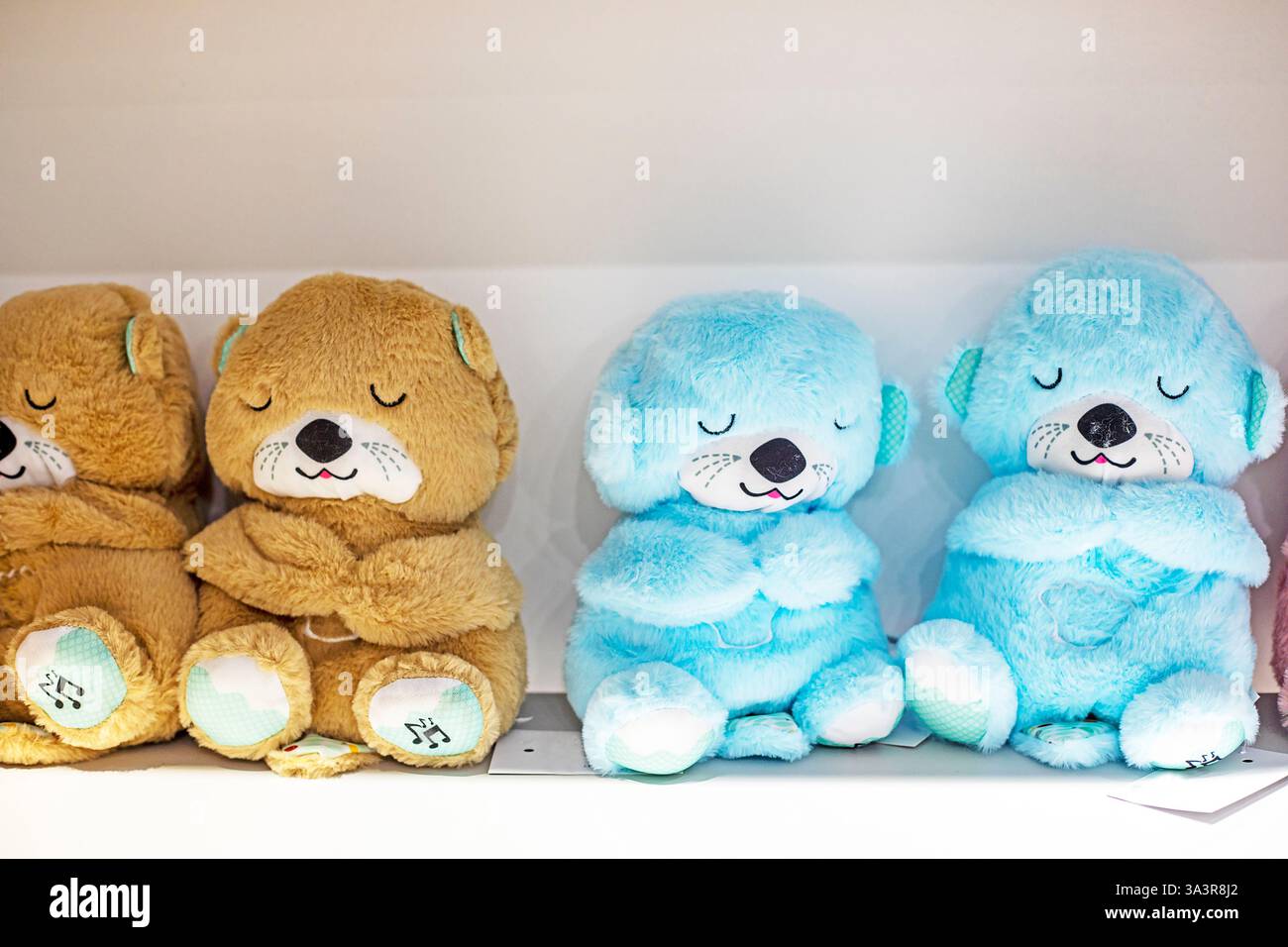 cute plush animals on a shelf in a supermarket Stock Photo - Alamy