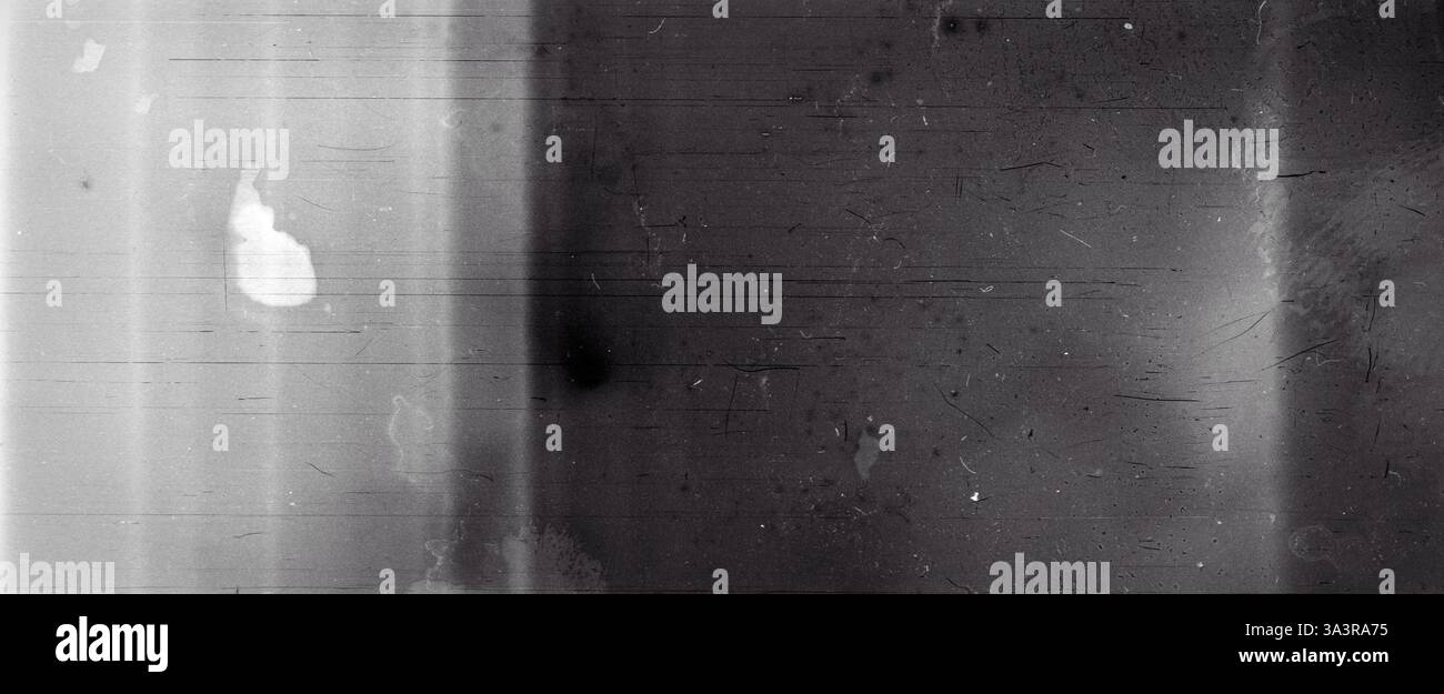 Blank grained film strip texture background with heavy grain, dust and ...