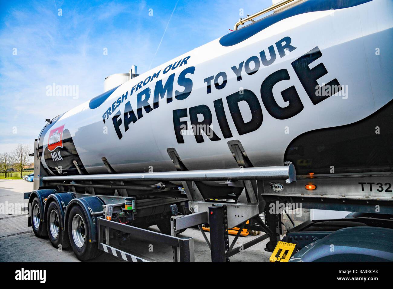 A milk tanker collecting milk from a farm in Cheshire, UK Stock Photo ...