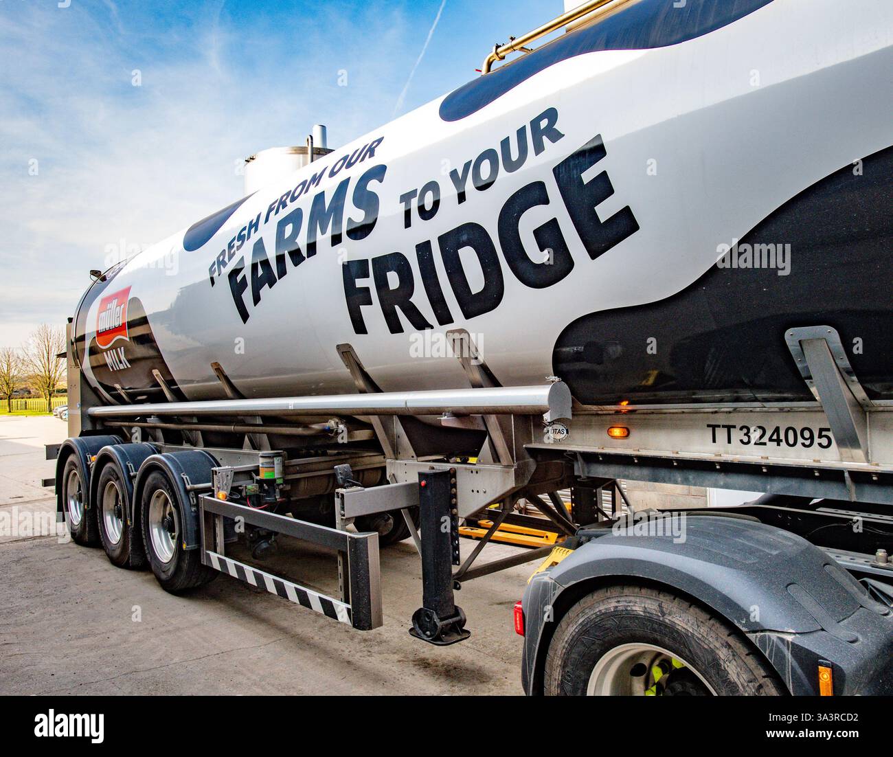 A milk tanker collecting milk from a farm in Cheshire, UK Stock Photo ...