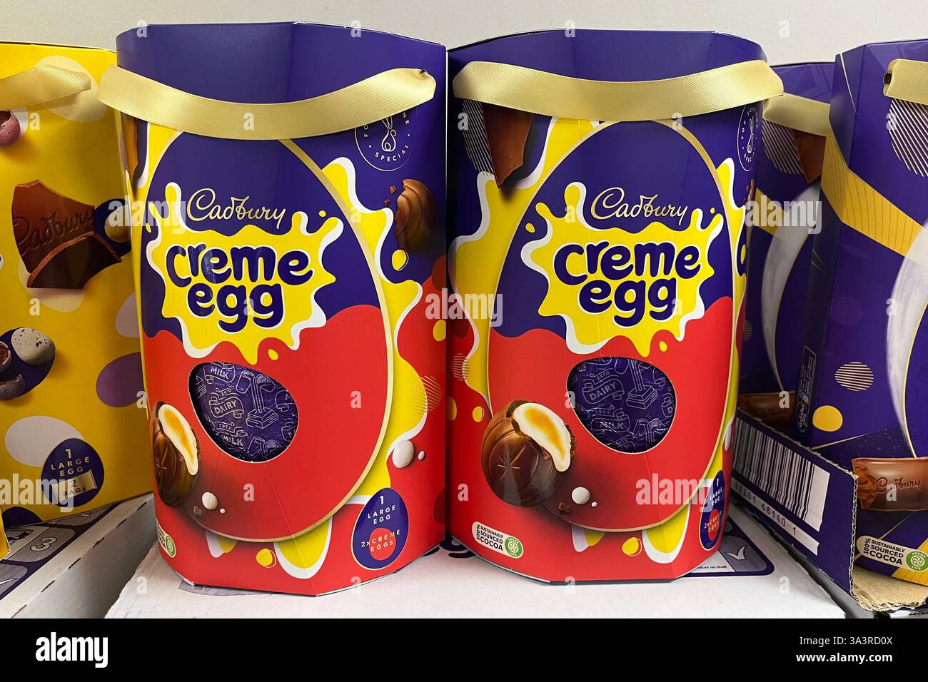 Two Cadbury Creme Egg Easter Eggs on a Tesco Supermarket shelf. Swansea ...