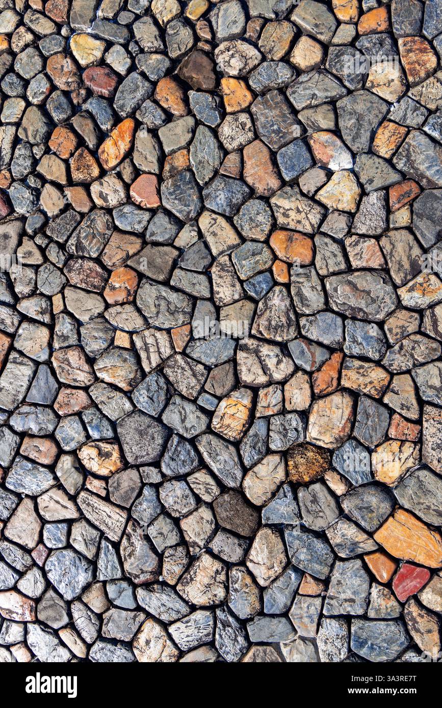 Natural stone background featuring rough irregularly shaped rocks in ...