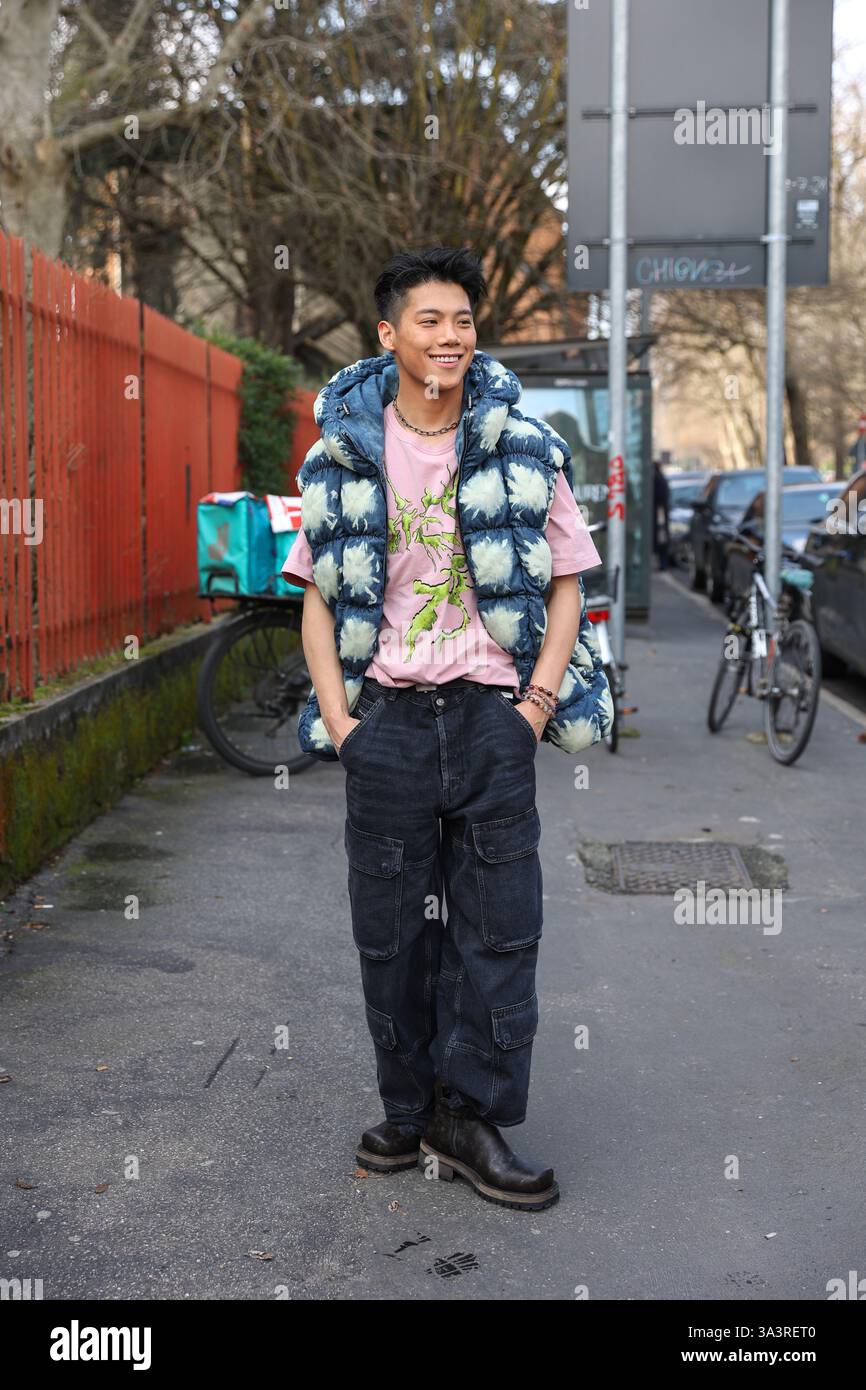 Milan, Italy. 26th Feb, 2025. A guest poses for photos before FW 2025/ ...